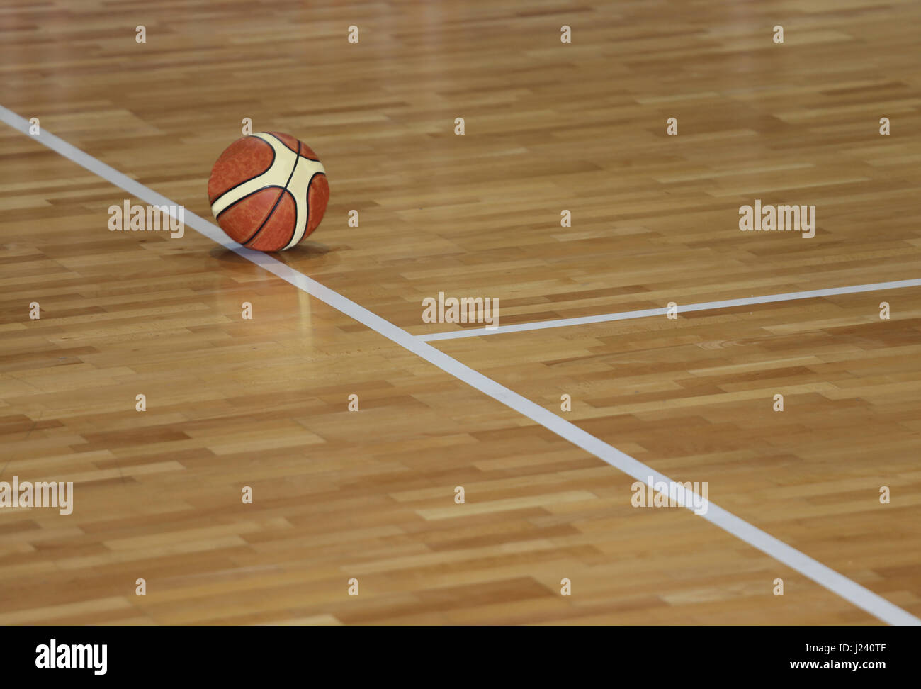 Isolated basketball on the basketball court of the sports hall Stock ...