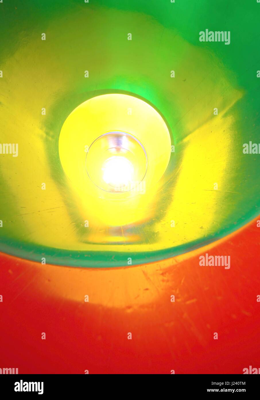 abstract endless plastic tunnel in green red and yellow colors in the ...