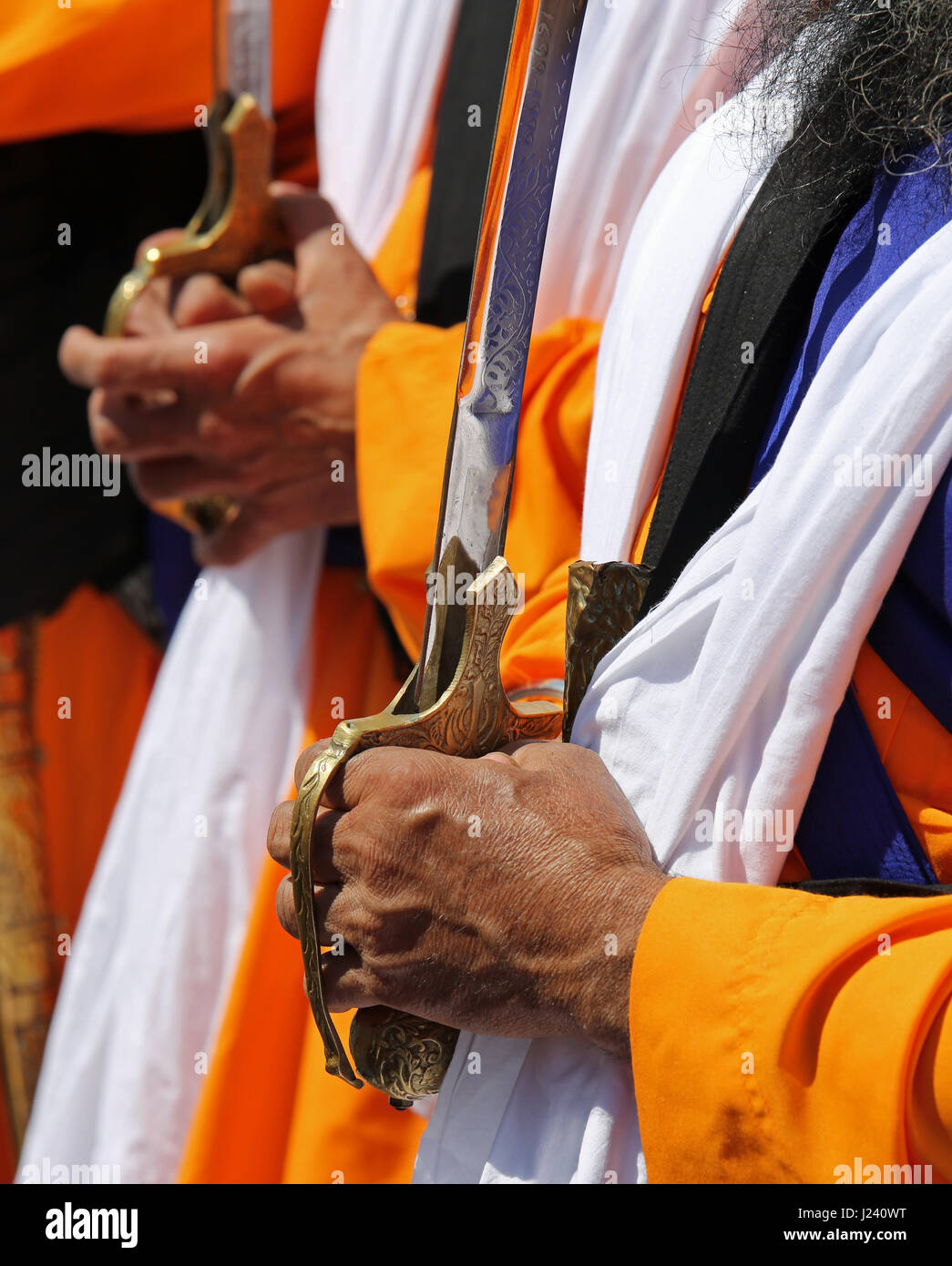 Sikh senior man with the sword during religious ceremony Stock Photo ...