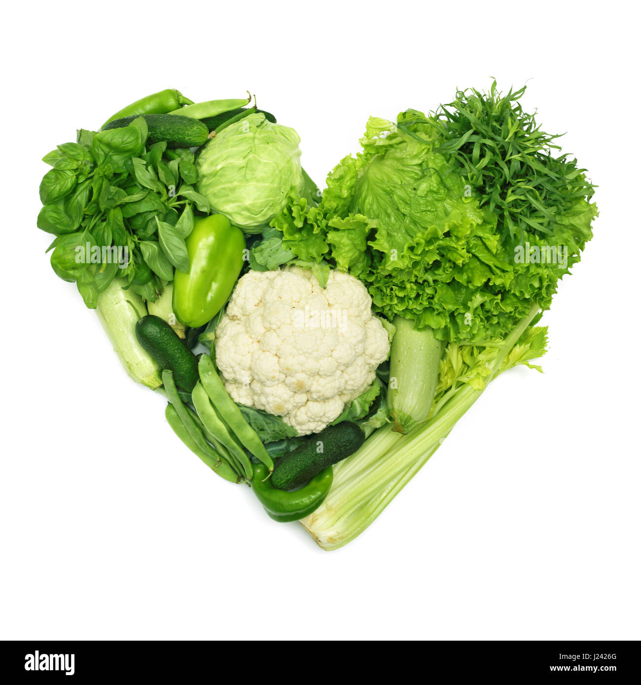 Pile of vegetables shaped as heart isolated on white background Stock ...