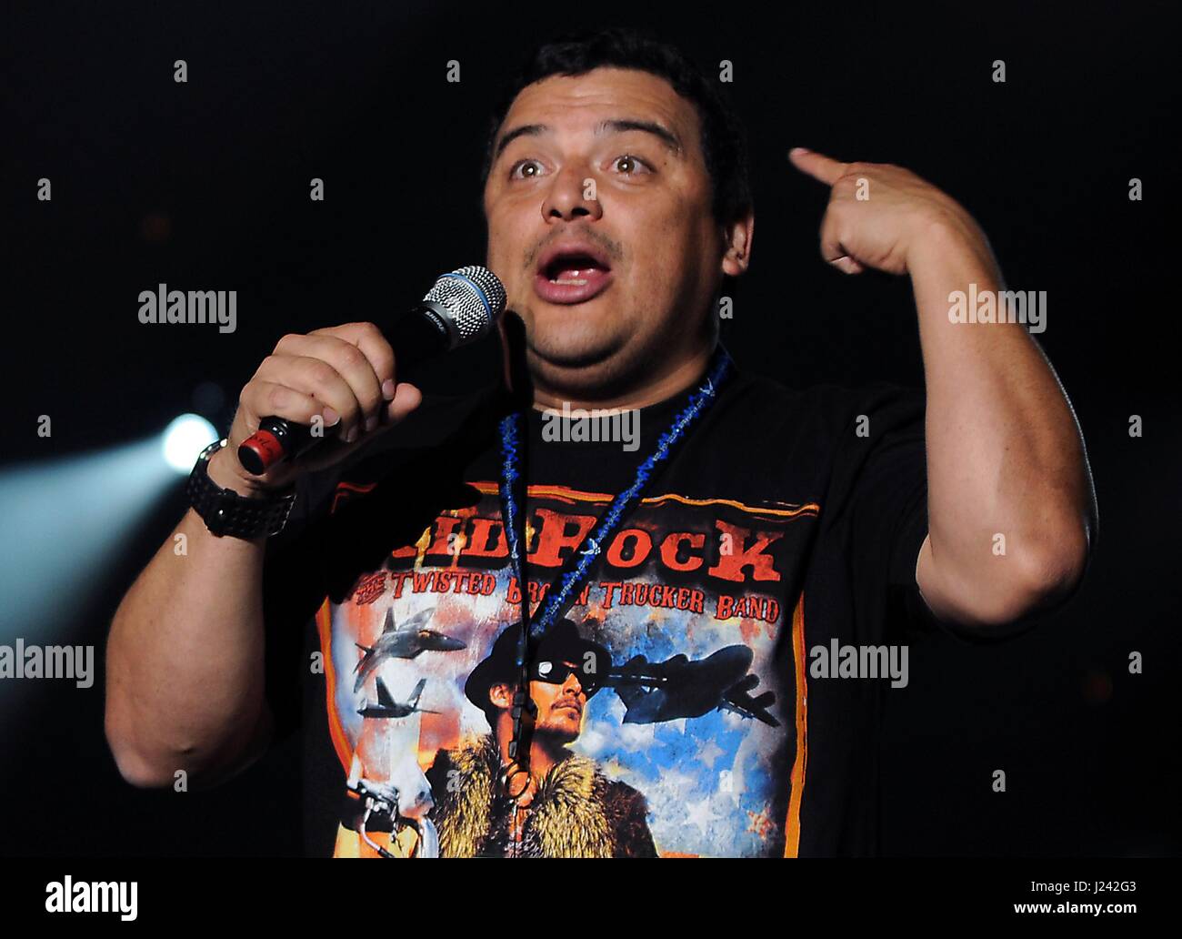 Comedian Carlos Mencia performs for U.S. soldiers during the Tour for ...