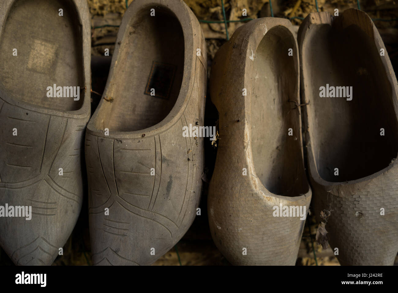 Traditional pairs of old Dutch wooden clog shoes Stock Photo - Alamy