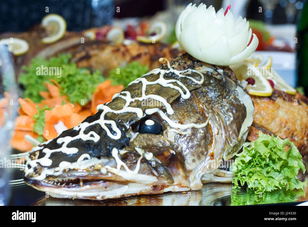 Pike stuffed and baked. A festive table setting Stock Photo - Alamy