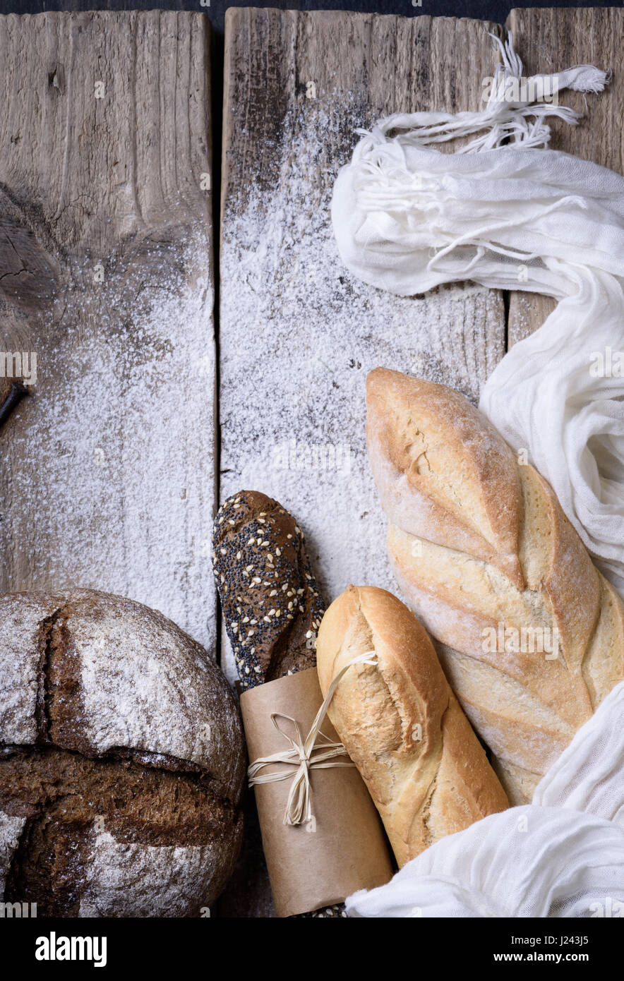 Bakery background. Baked variety of bread with over rustic kitchen ...
