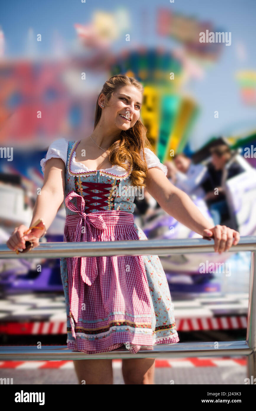 Attractive young woman at German funfair Oktoberfest with traditional ...