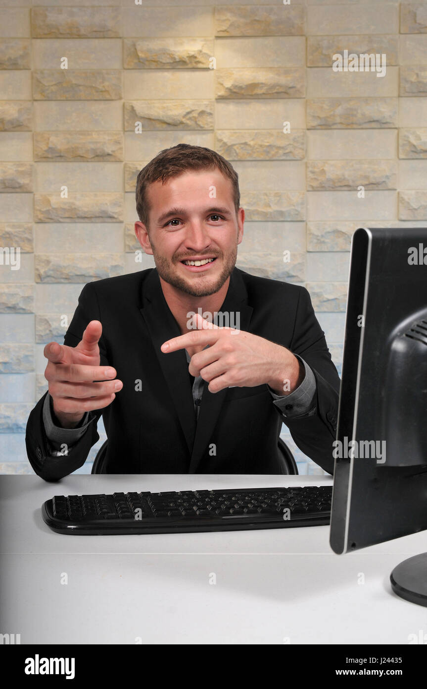 Handsome business man banker or salesman with a computer Stock Photo ...