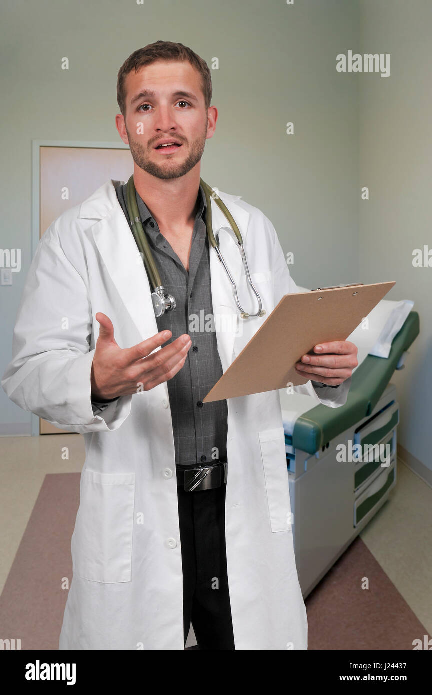 Young male doctor waiting to go on rounds Stock Photo - Alamy
