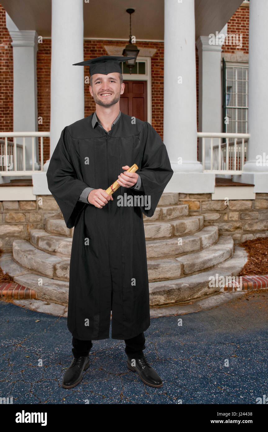 Young man in his graduation robes Stock Photo - Alamy