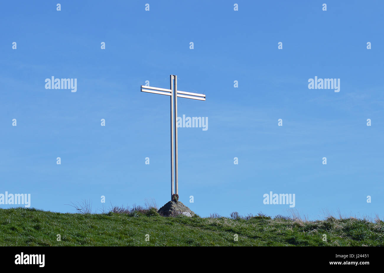 A silver metal Christian cross on hillside overlooking Aberdeen ...