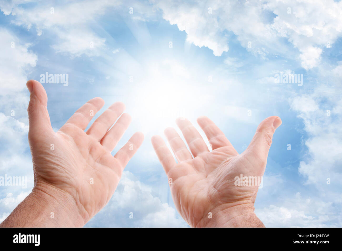 Hands reaching for the sky Stock Photo - Alamy