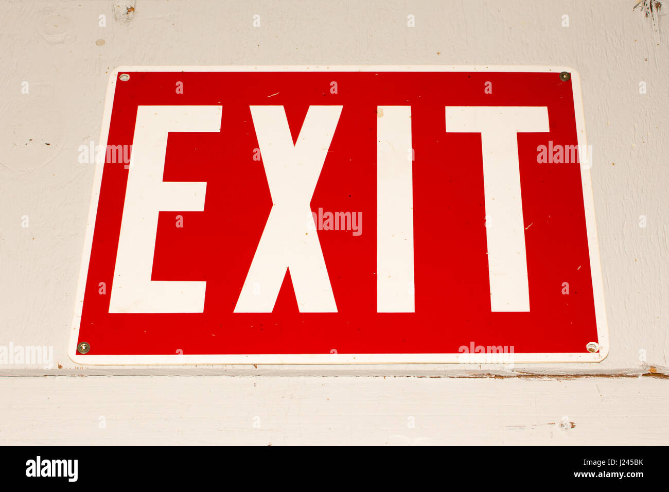 Exit Sign on White Wood Paneling Stock Photo - Alamy