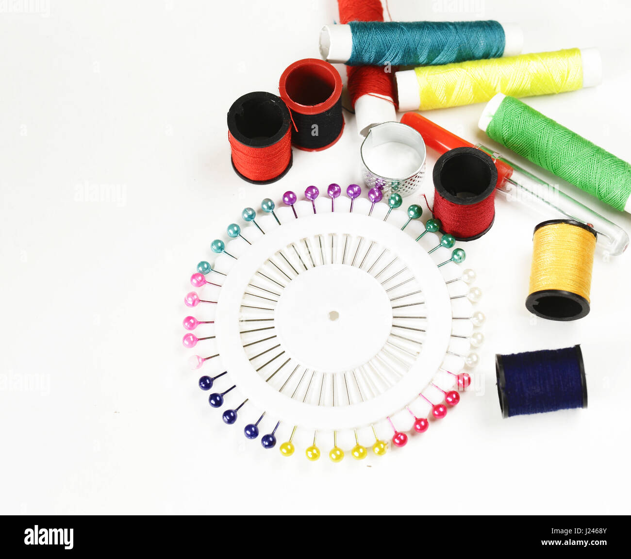 Threads, pins, needles - sewing tools Stock Photo - Alamy