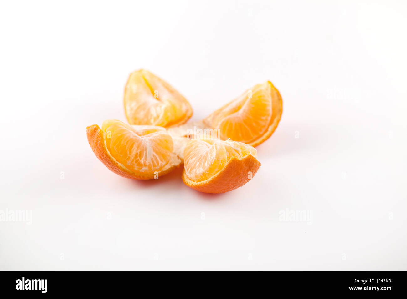 Whole half mandarin orange reflection hi-res stock photography and ...