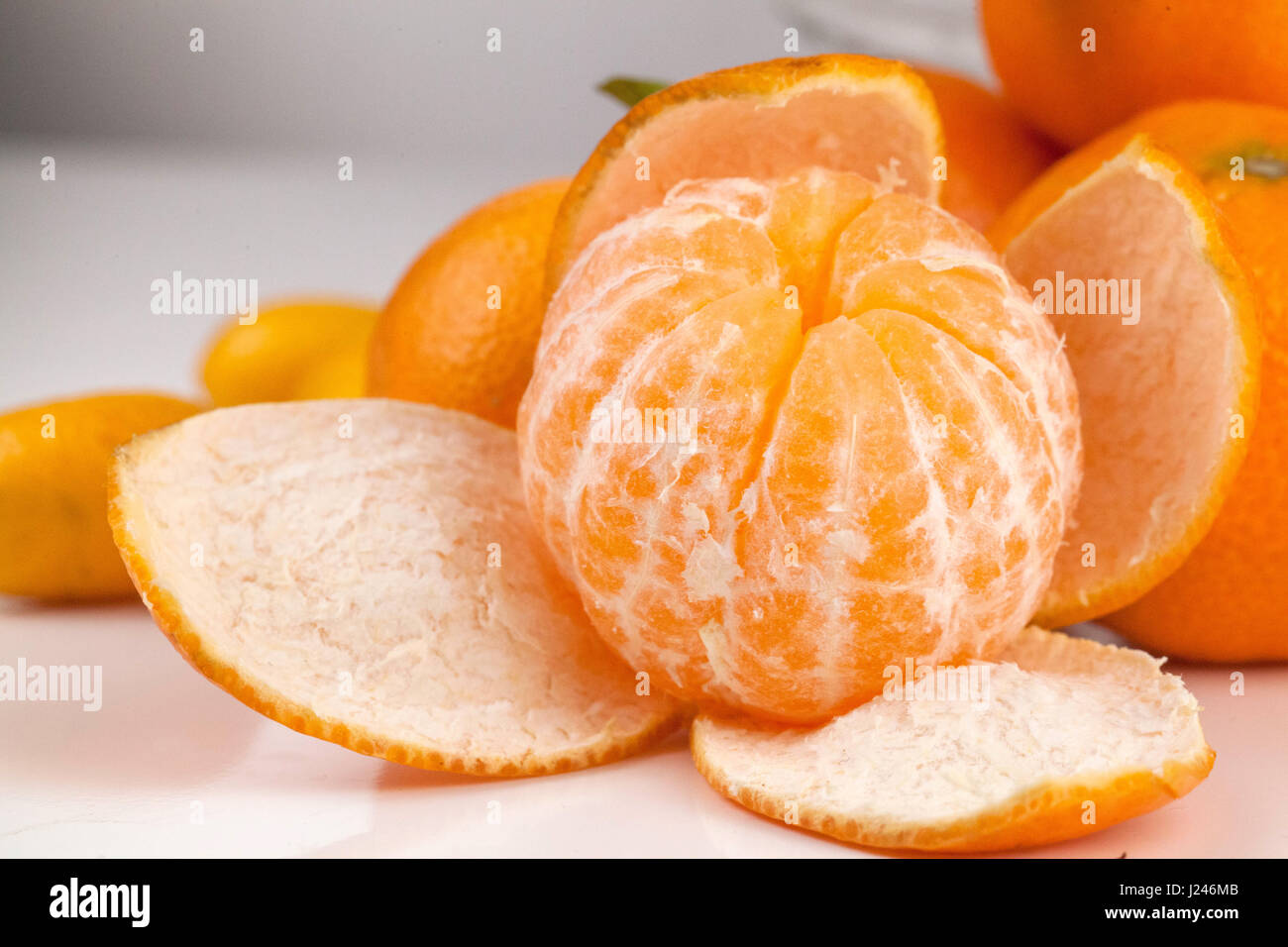 Whole half mandarin orange reflection hi-res stock photography and ...