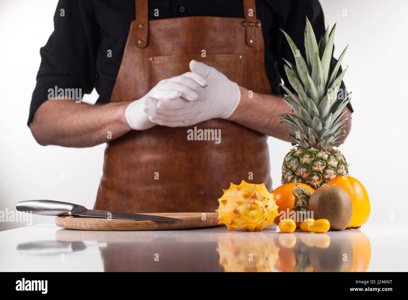 Composition of tropical fruits and a chef standing behand Stock Photo ...