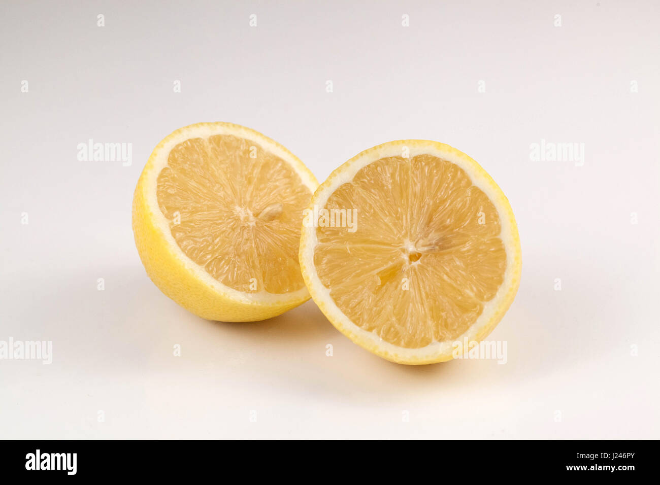 Lemons. Fresh ripe lemon on white background. Lemon cut in halves Stock ...