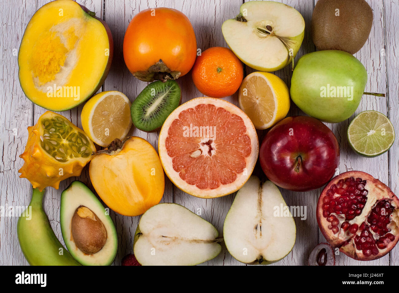 Composition of colourful ripe fresh tropical fruits placed together on ...