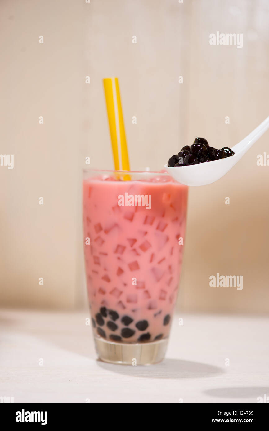 Boba / Bubble tea. Homemade Strawberry Milk Tea with Pearls on wooden ...
