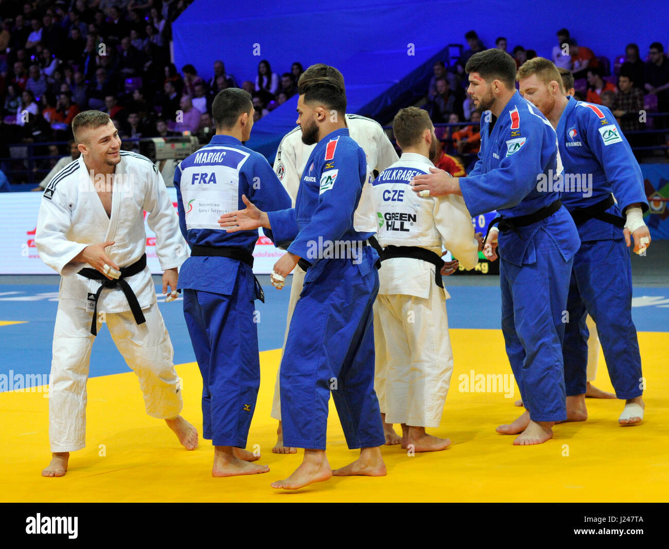French (in blue) and Czech judokas greets after the Czech Republic vs ...