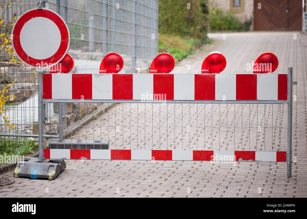 Closed street with construction sign barrier Stock Photo - Alamy