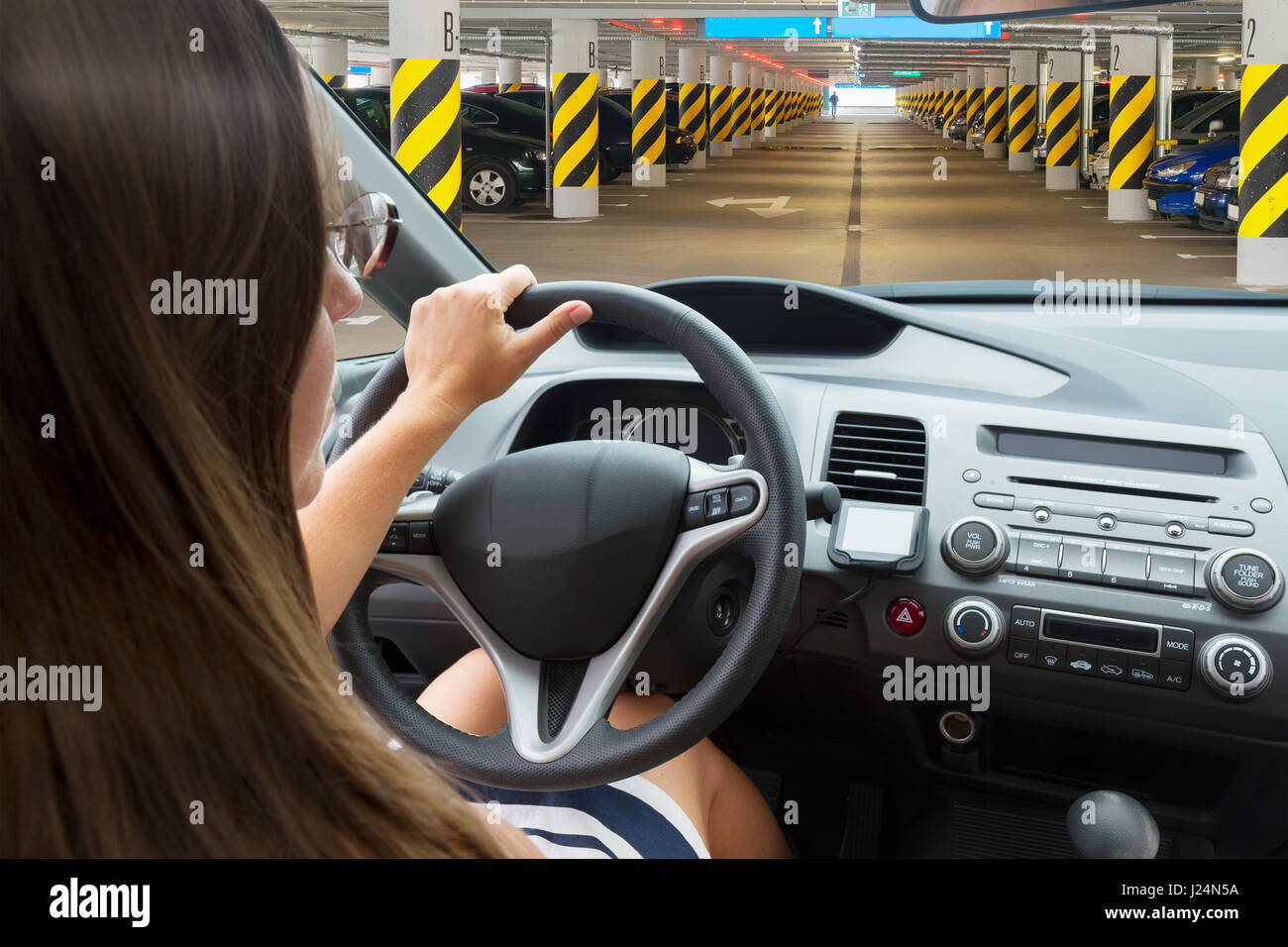 Female car parking garage hi-res stock photography and images - Alamy