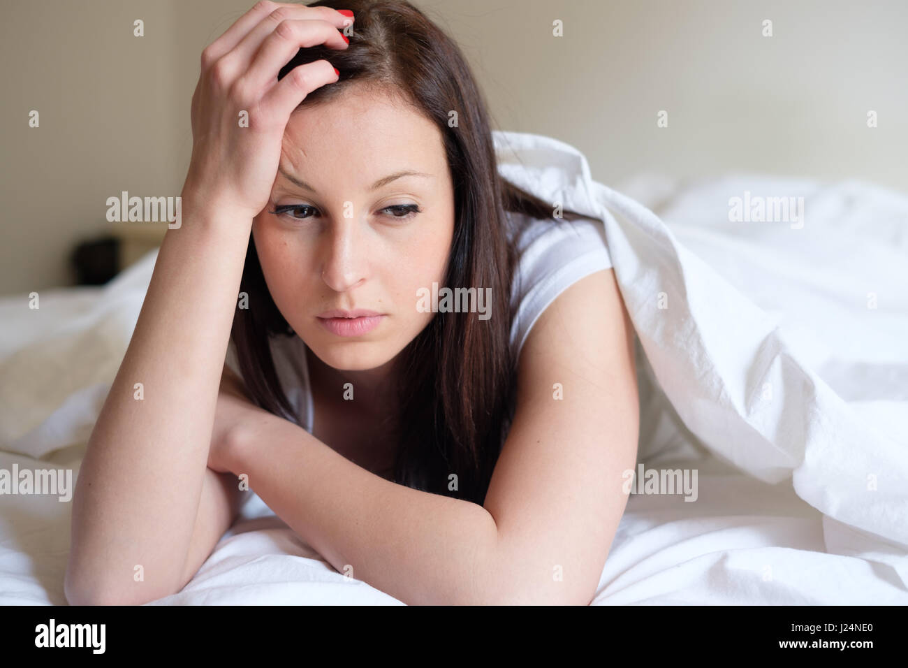 Woman guilty in bed hi-res stock photography and images - Alamy