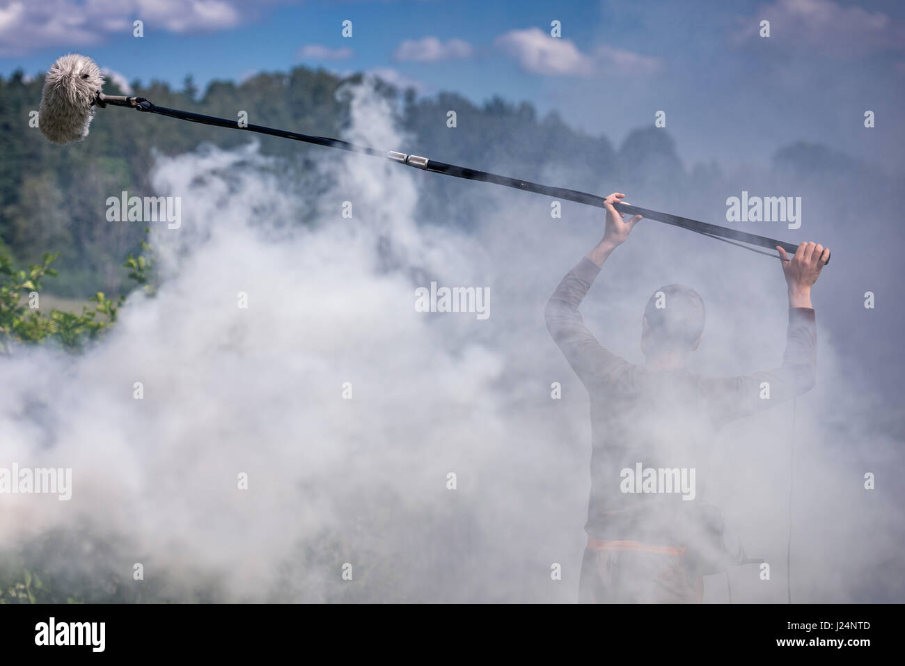 Film industry. Operator with microphone fire during filming Stock Photo ...