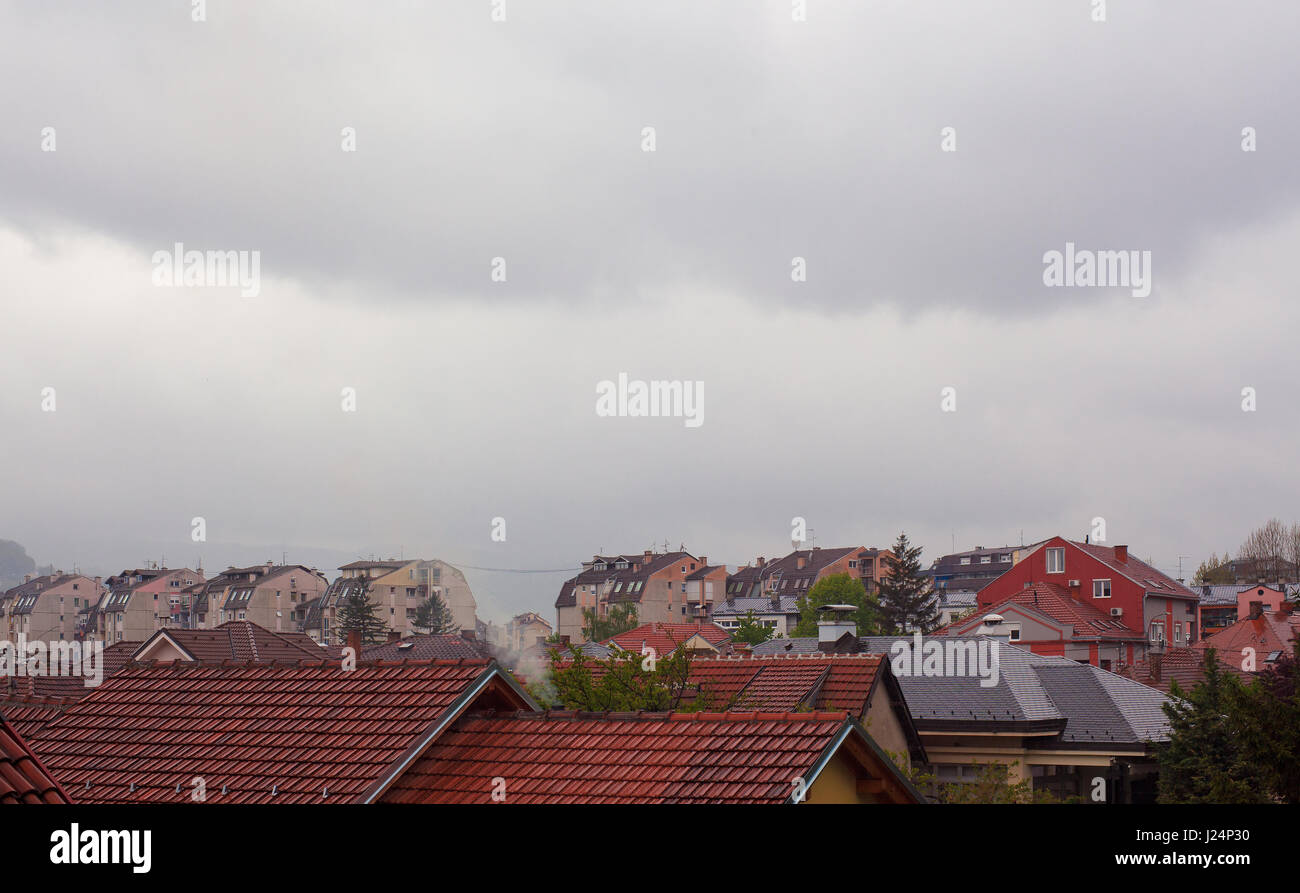 Big gray cloud over the buildings, bad weather Stock Photo - Alamy