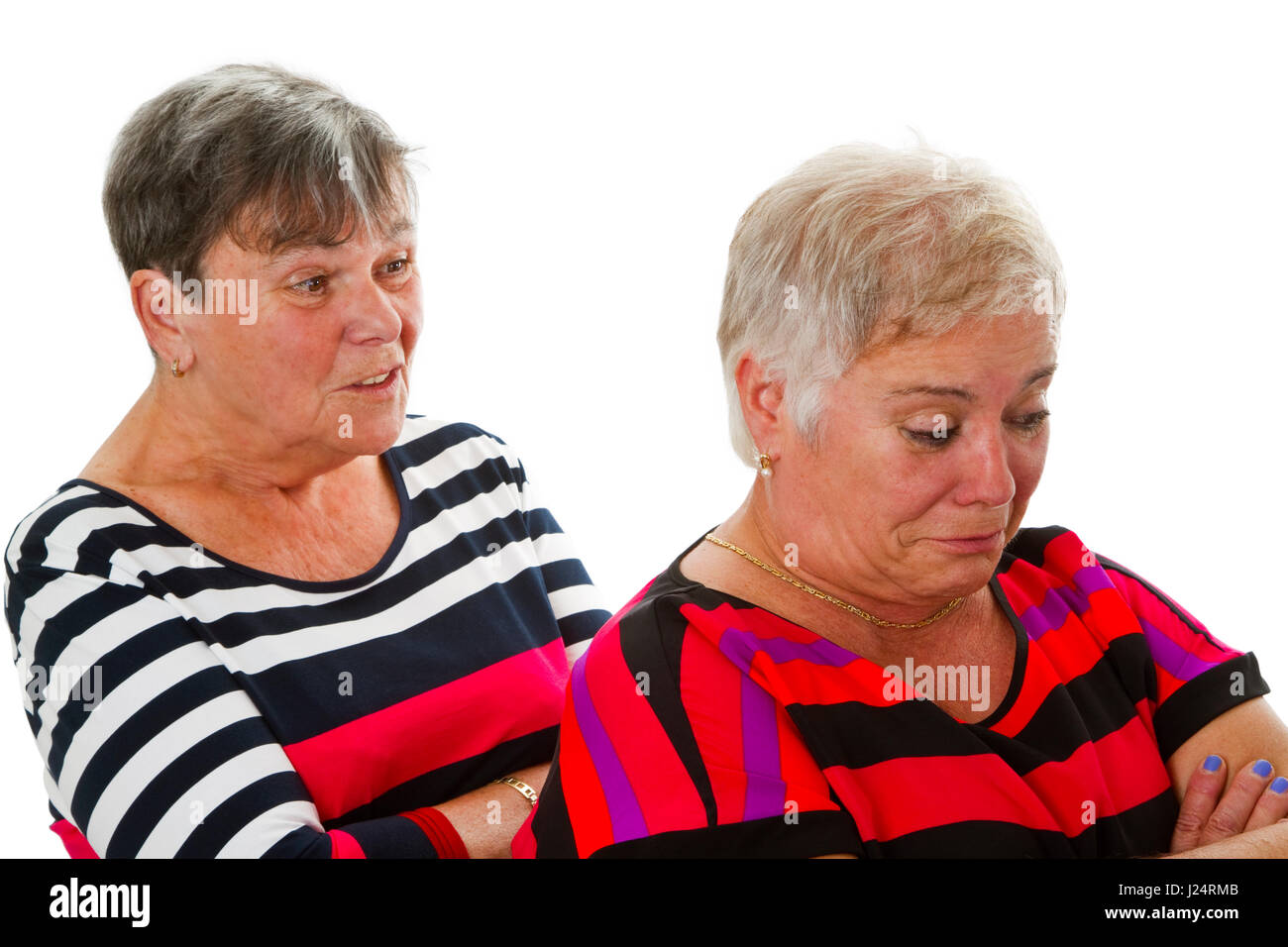 Two female seniors in dispute - isolated on white background Stock ...