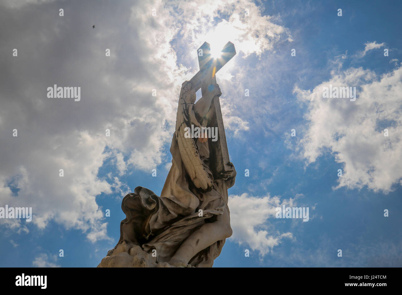 A statue with cross by Bernini on Saint Angel's Bridge, Rome, Italy ...
