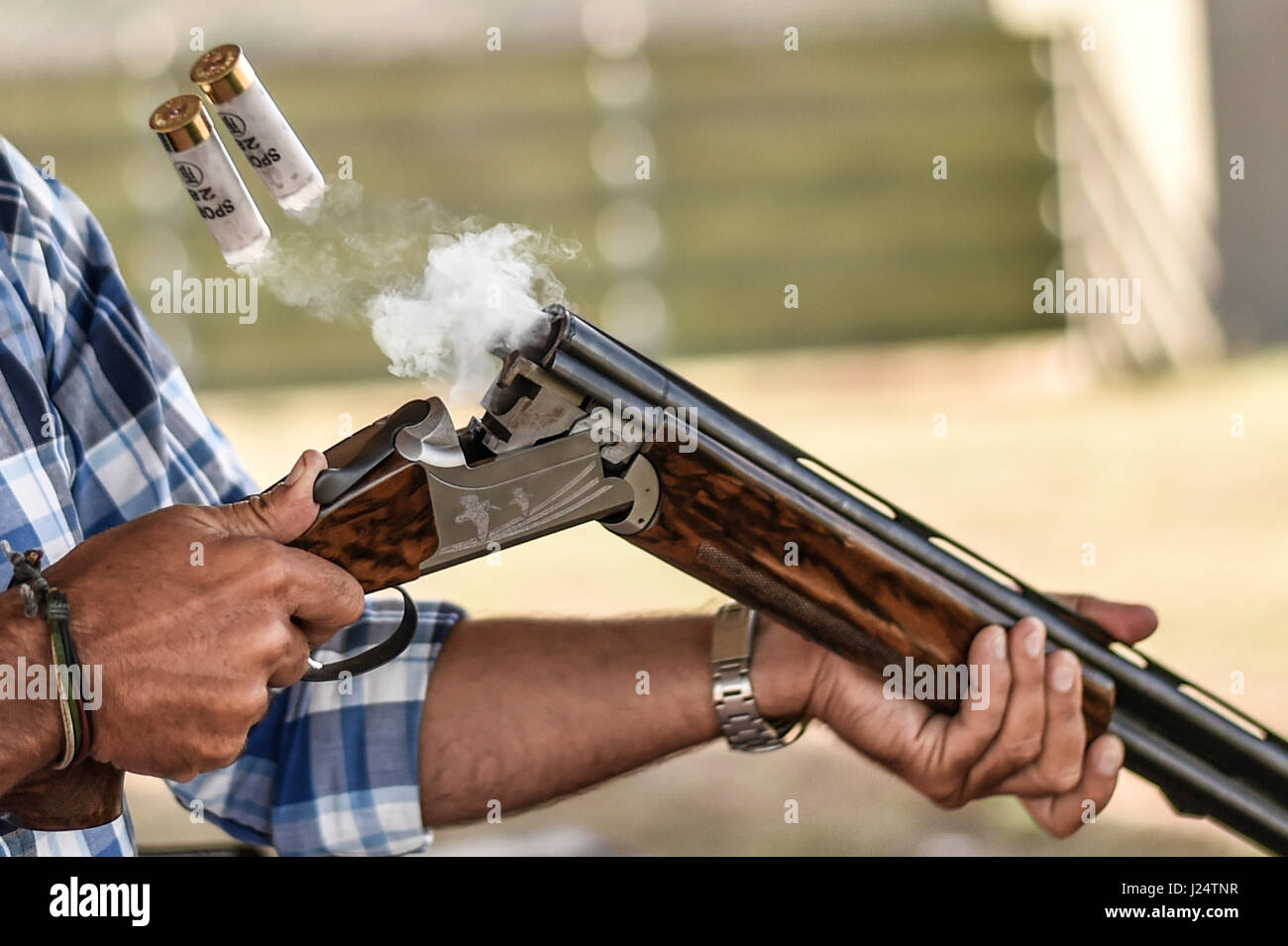 Hunting rifle cartridges and smocke after firing. Hunting in the forest ...