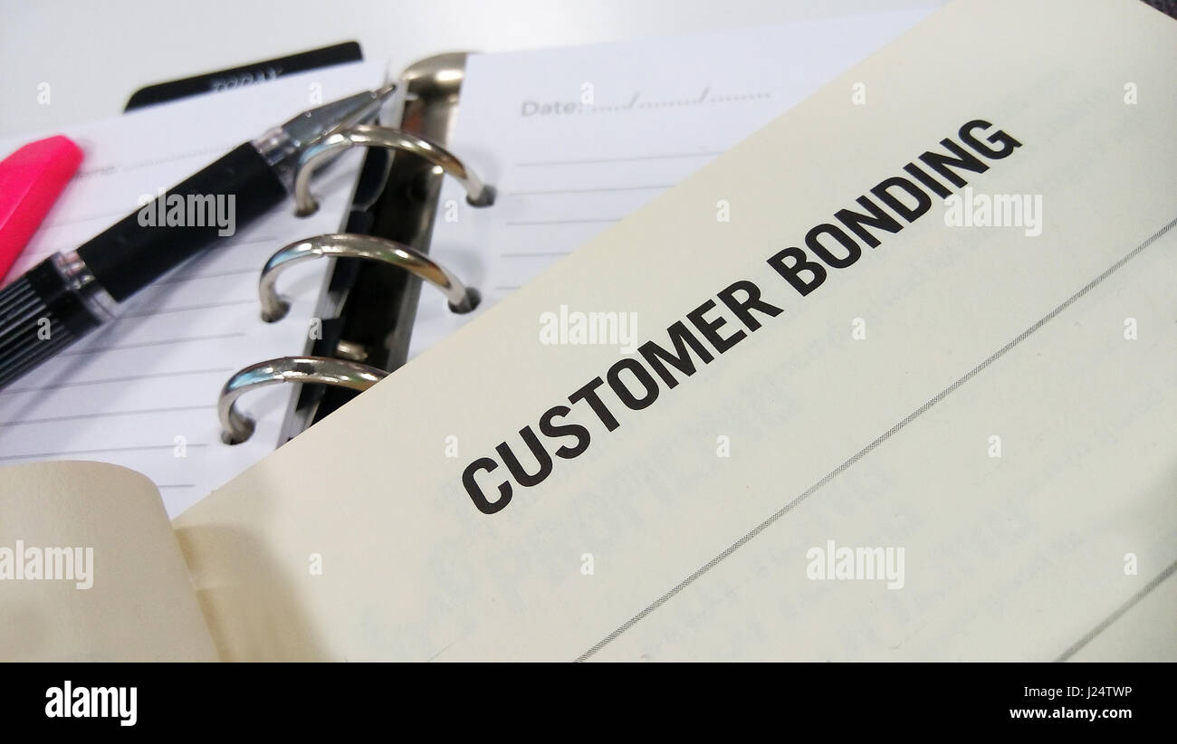 Customer bonding printed on a white book Stock Photo - Alamy