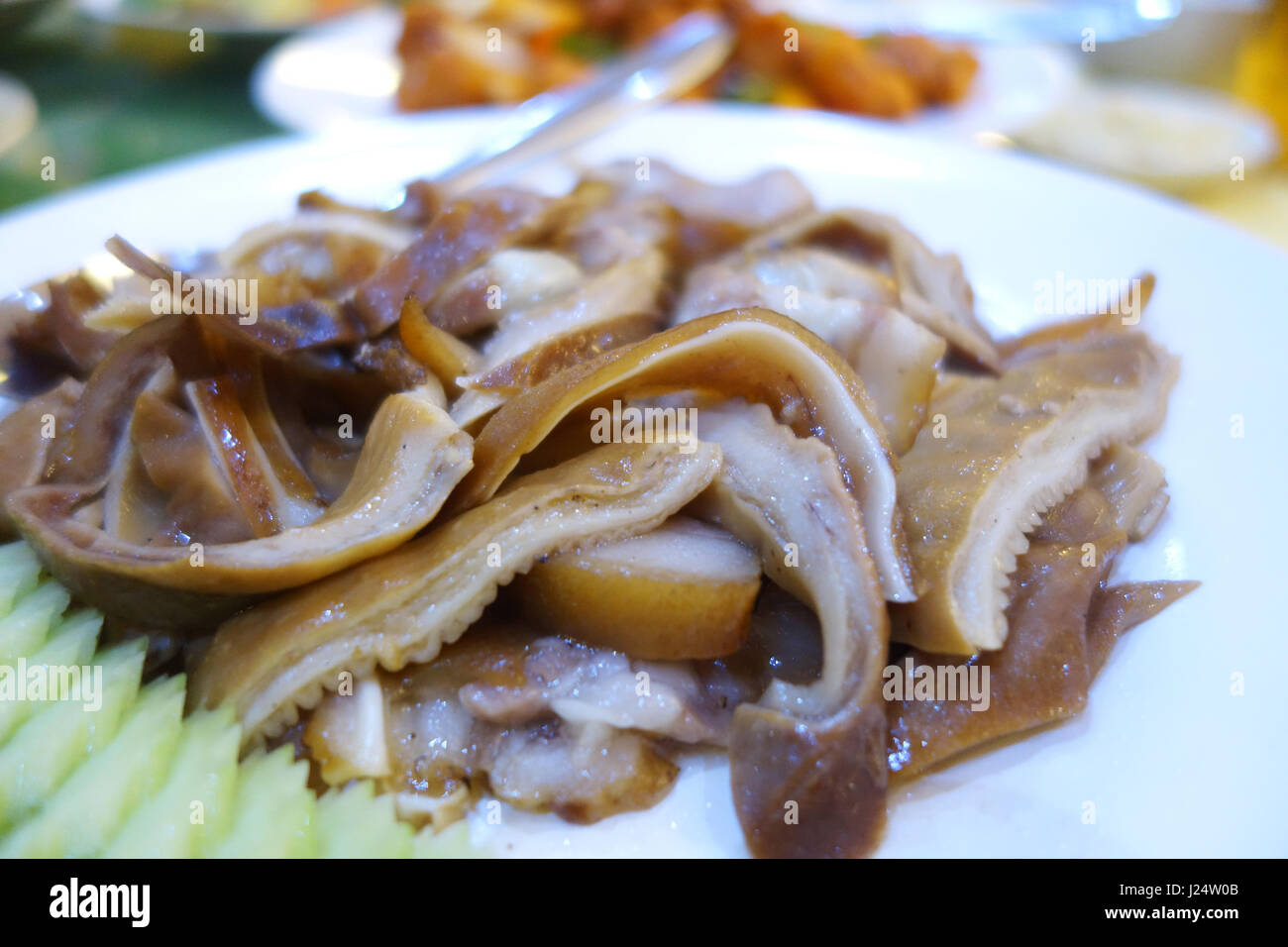 Pig ears cold dish on the plate Stock Photo - Alamy