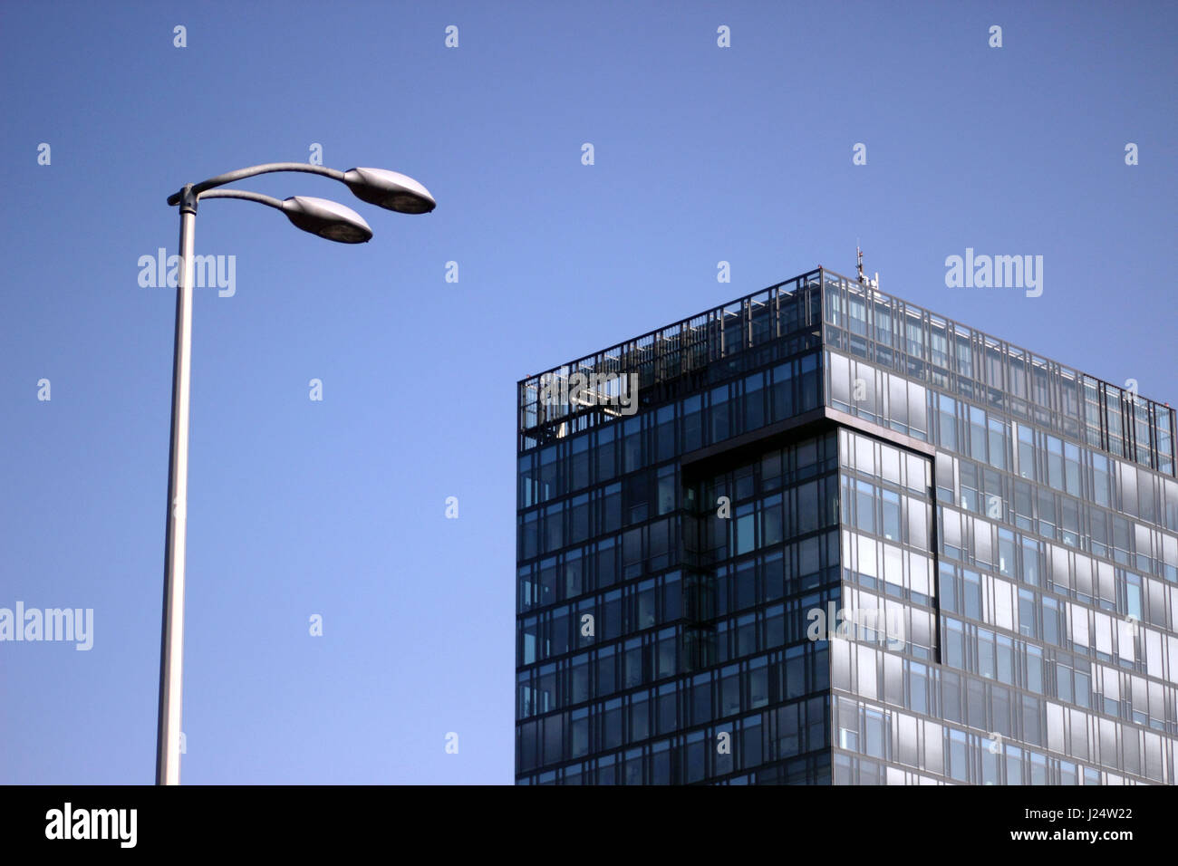 Office building and street light Stock Photo - Alamy