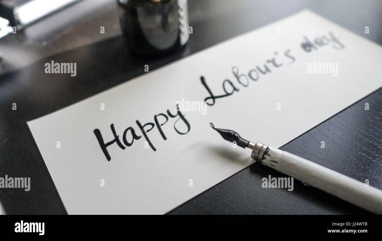 Happy labour's day calligraphy and lattering post card. Left view with ...