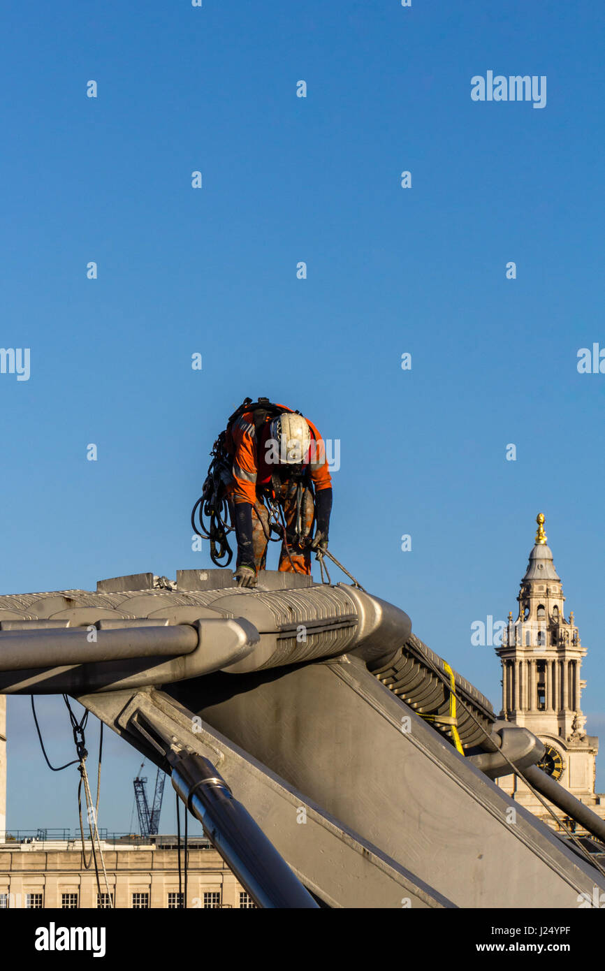 Bridge Engineer, wearing a safety harness, inspecting the Millennium ...