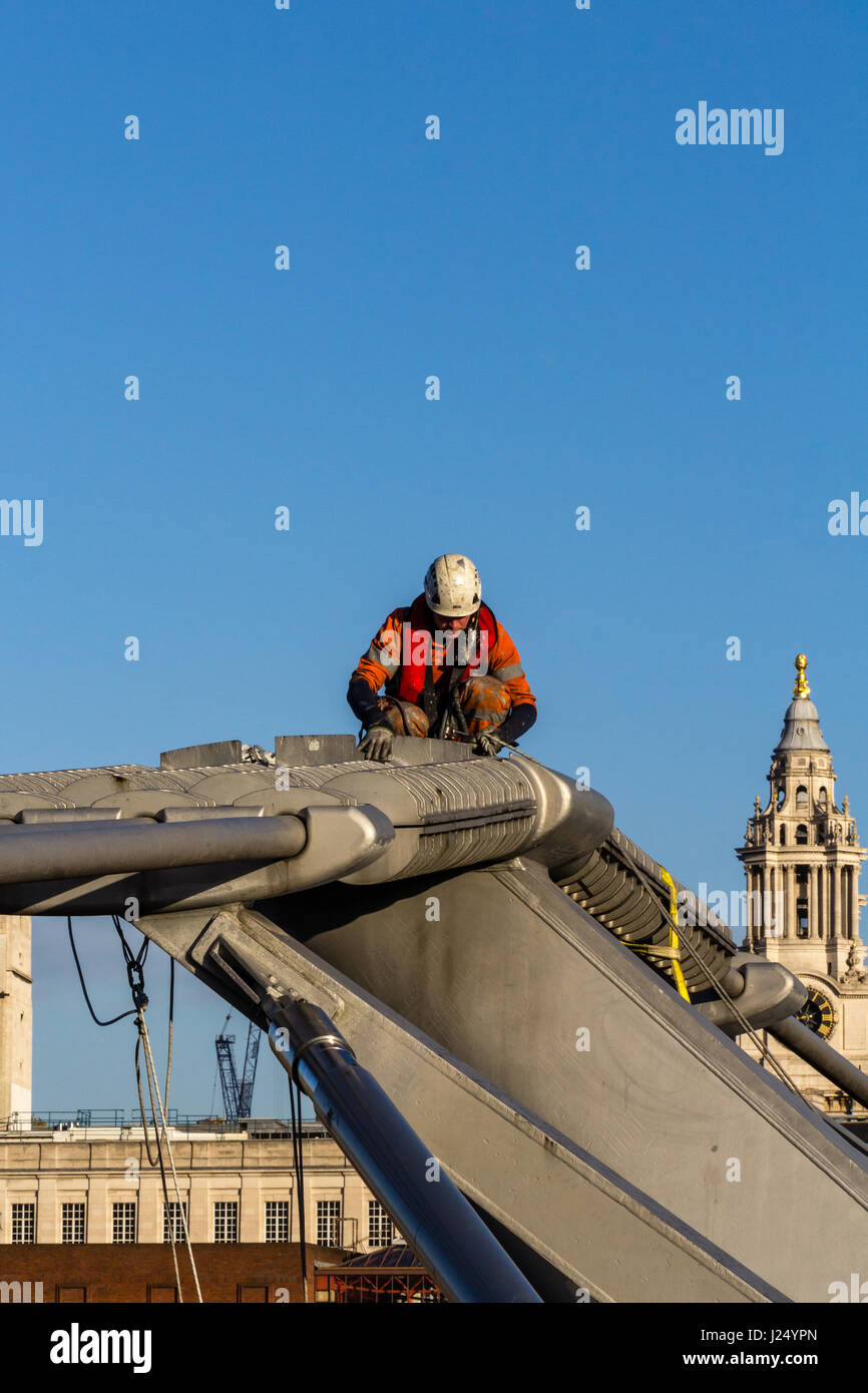 Bridge Engineer, wearing a safety harness, inspecting the Millennium ...