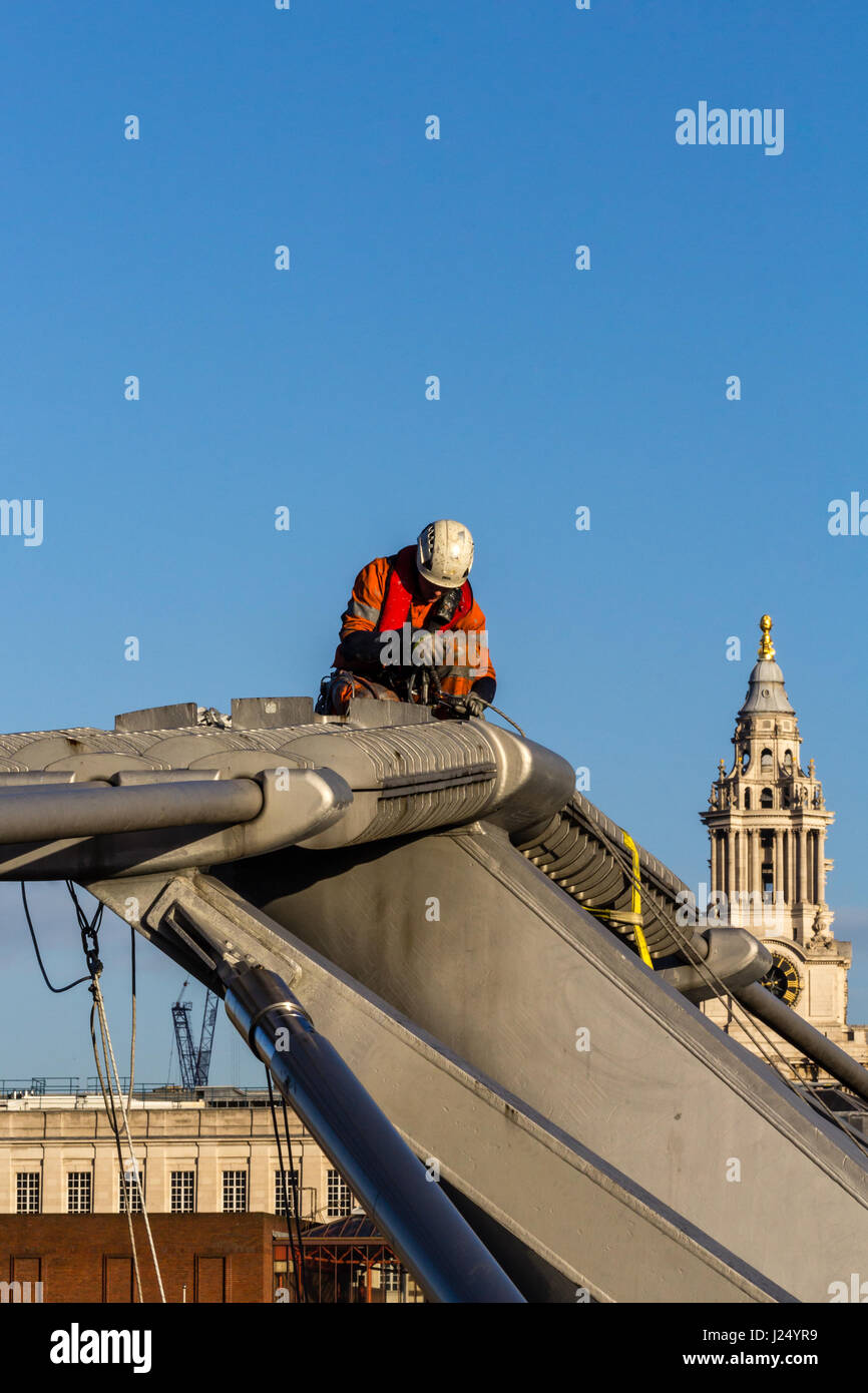 Bridge Engineer, wearing a safety harness, inspecting the Millennium ...