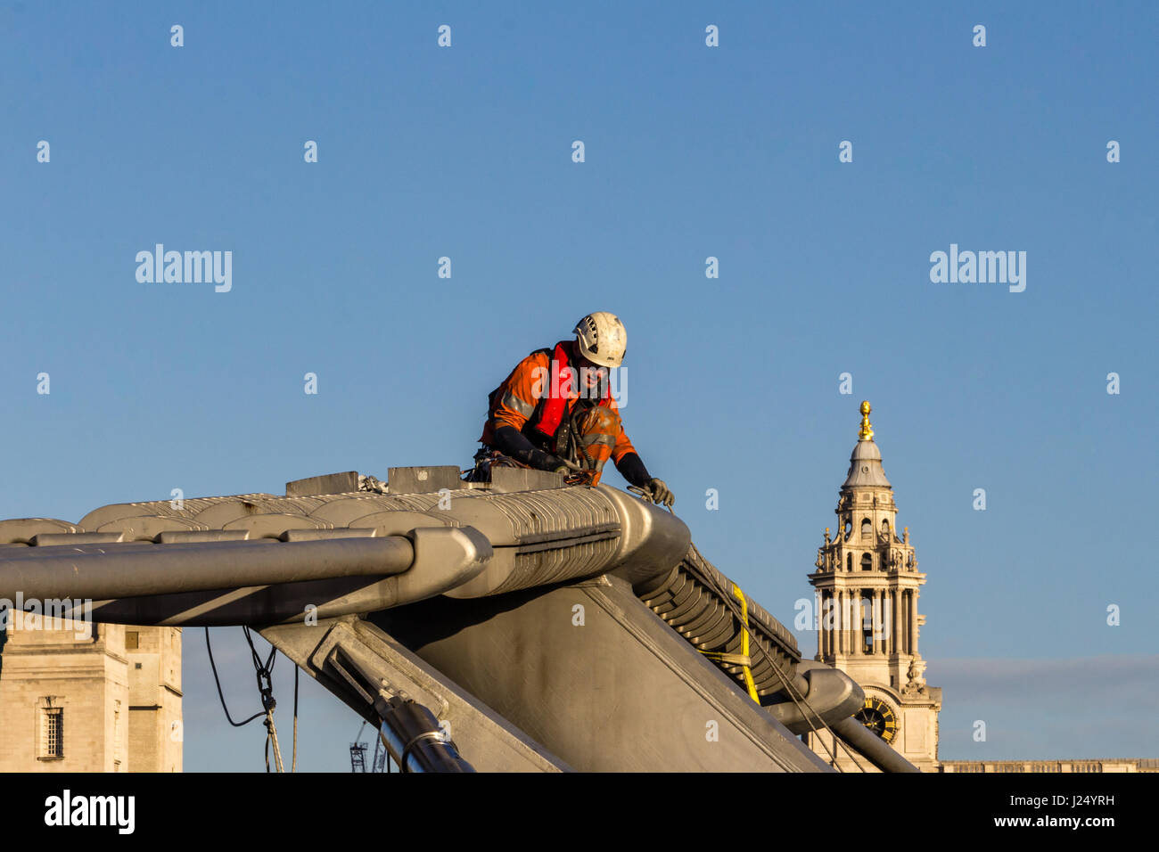 Bridge Engineer, wearing a safety harness, inspecting the Millennium ...