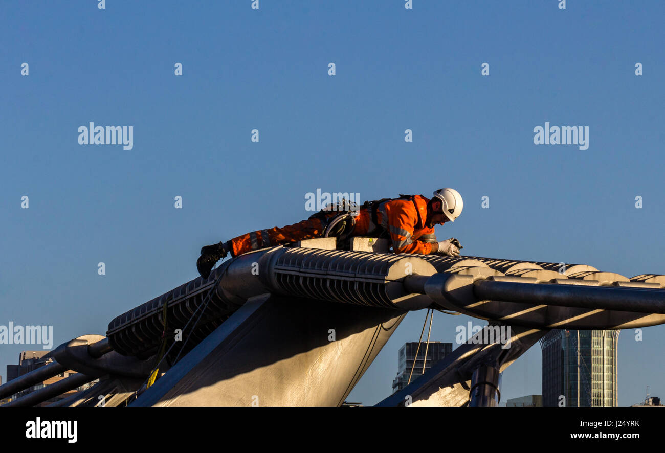 Bridge Engineer, wearing a safety harness, inspecting the Millennium ...