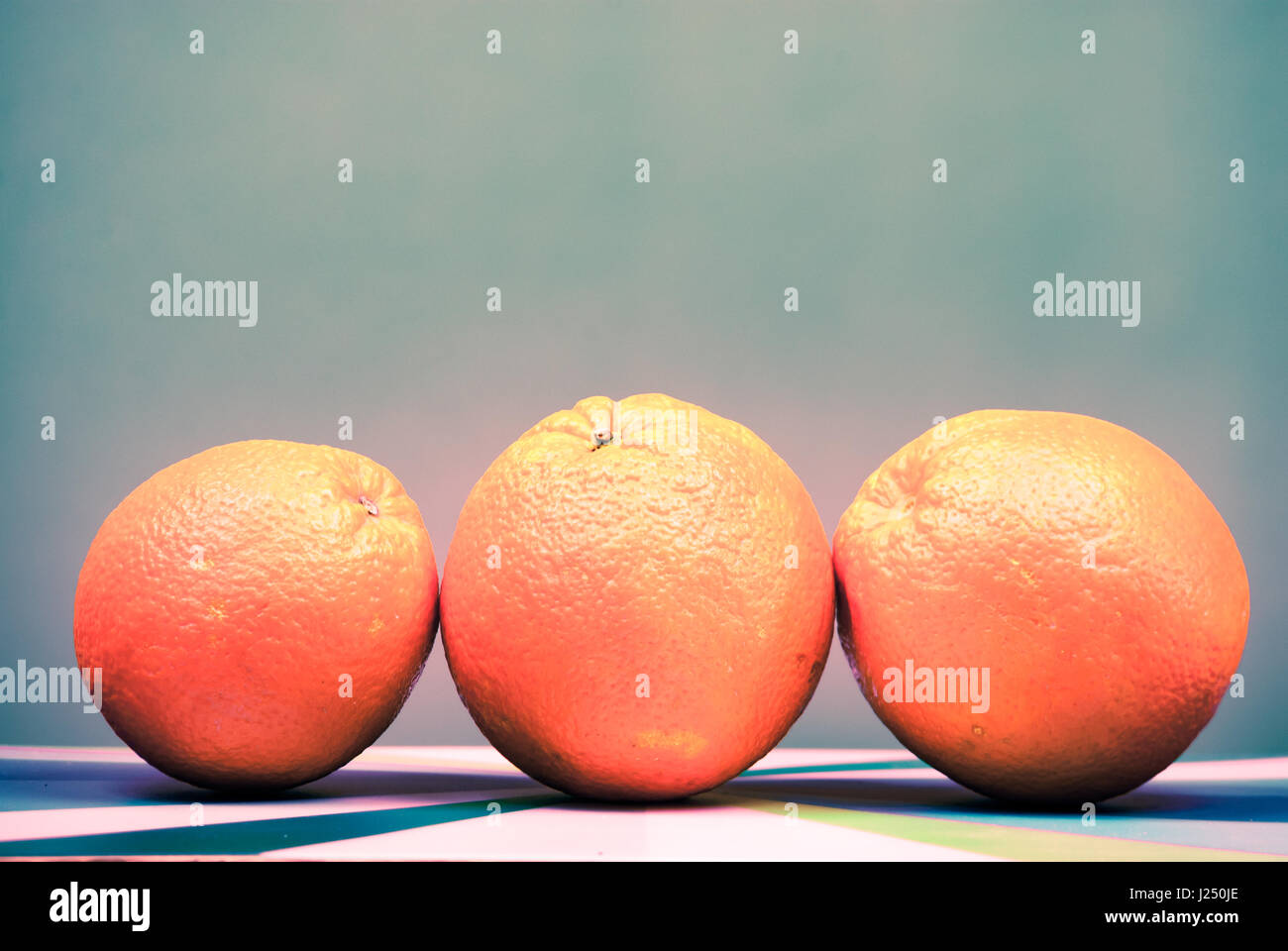 Orange fruit on colorful background Stock Photo - Alamy