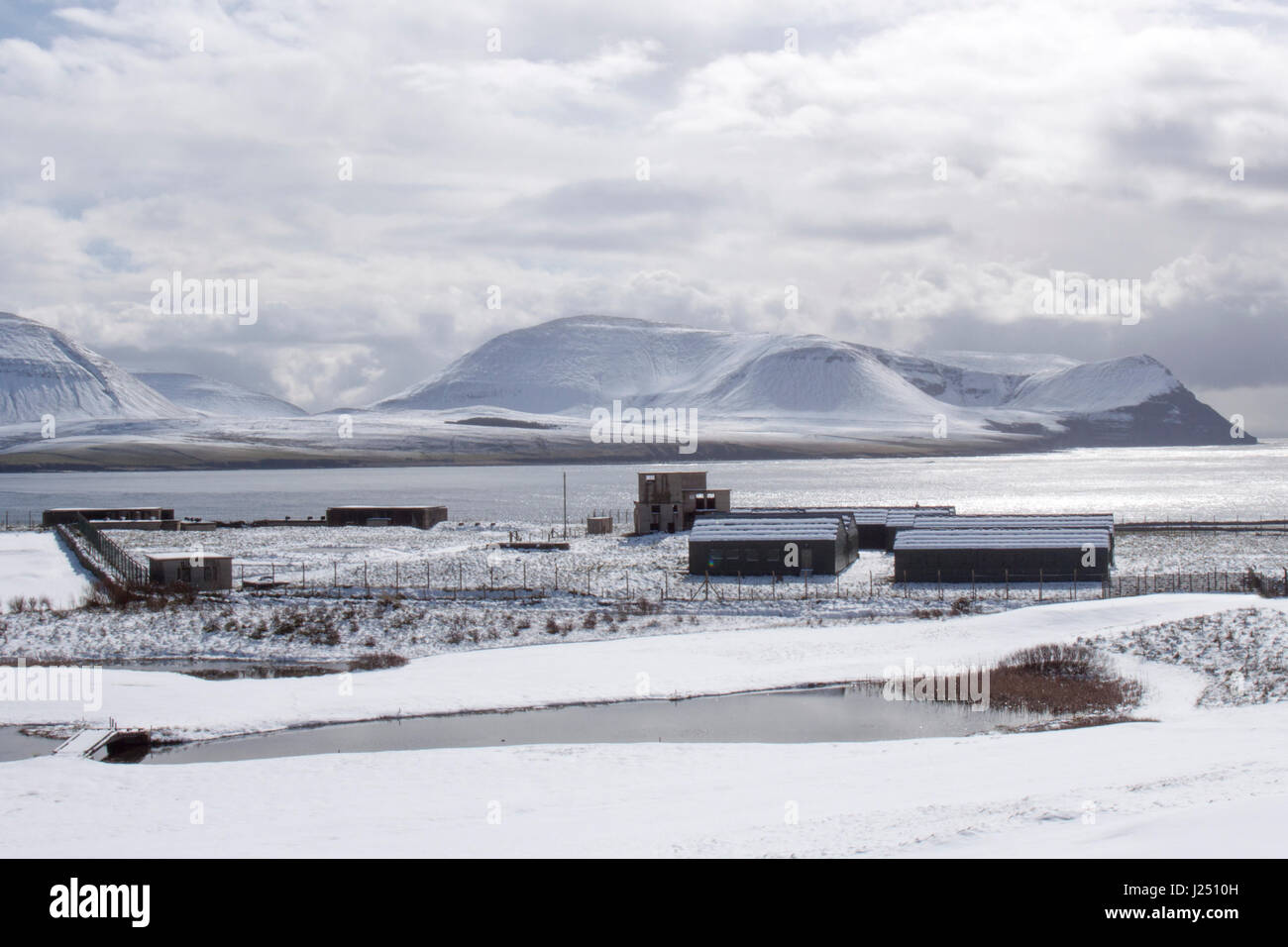 Ness Battery in Stromness covered in snow with Hoy hills in background ...