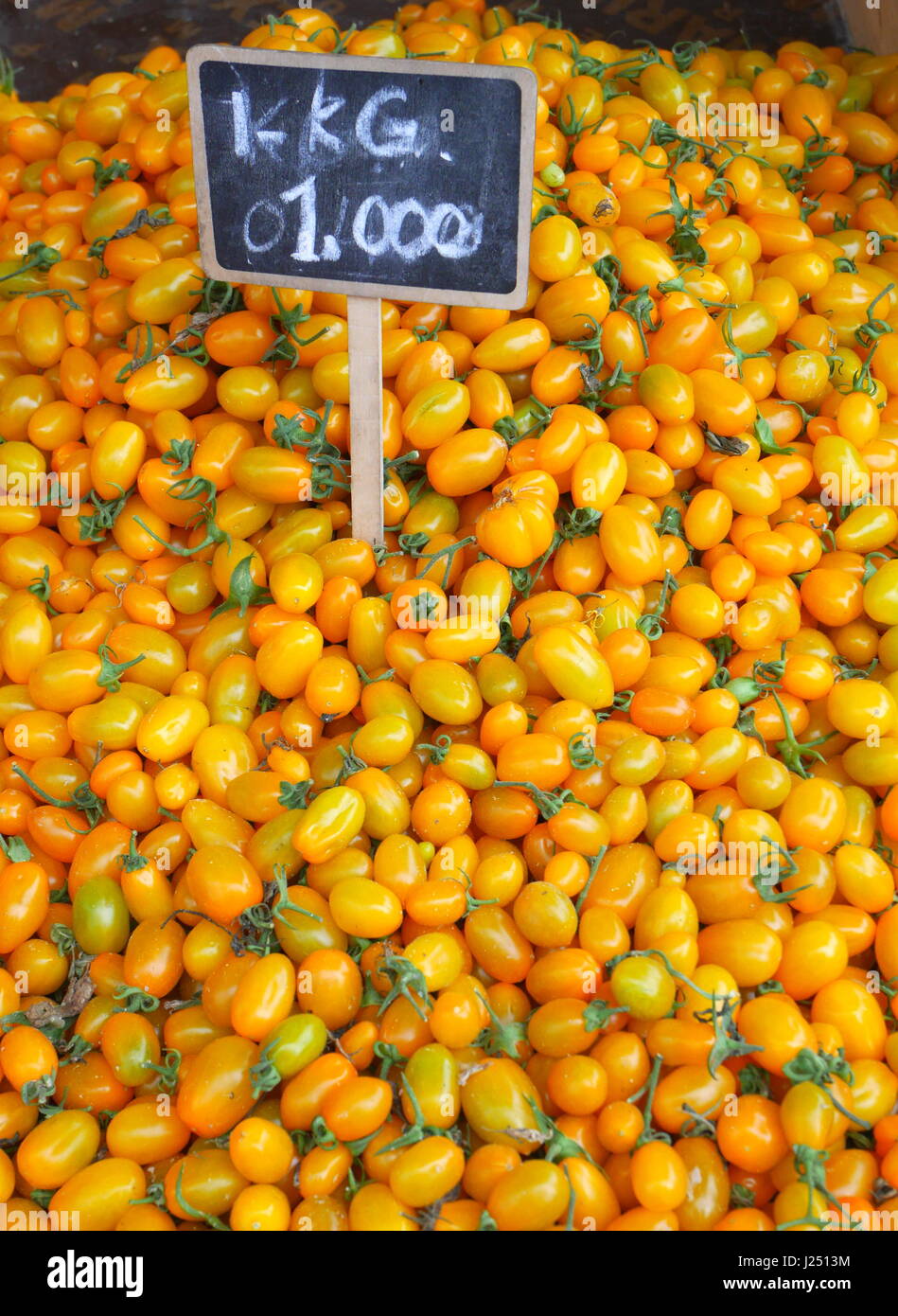 Small yellow tomatoes on a stall, Budaiya Farmers' Market, Kingdom of ...