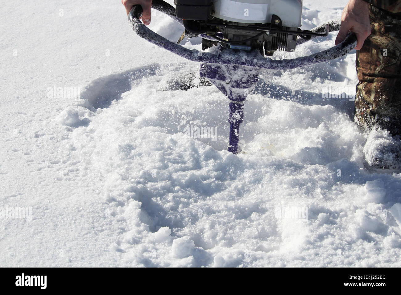 Fishing through frozen hole hi-res stock photography and images - Alamy