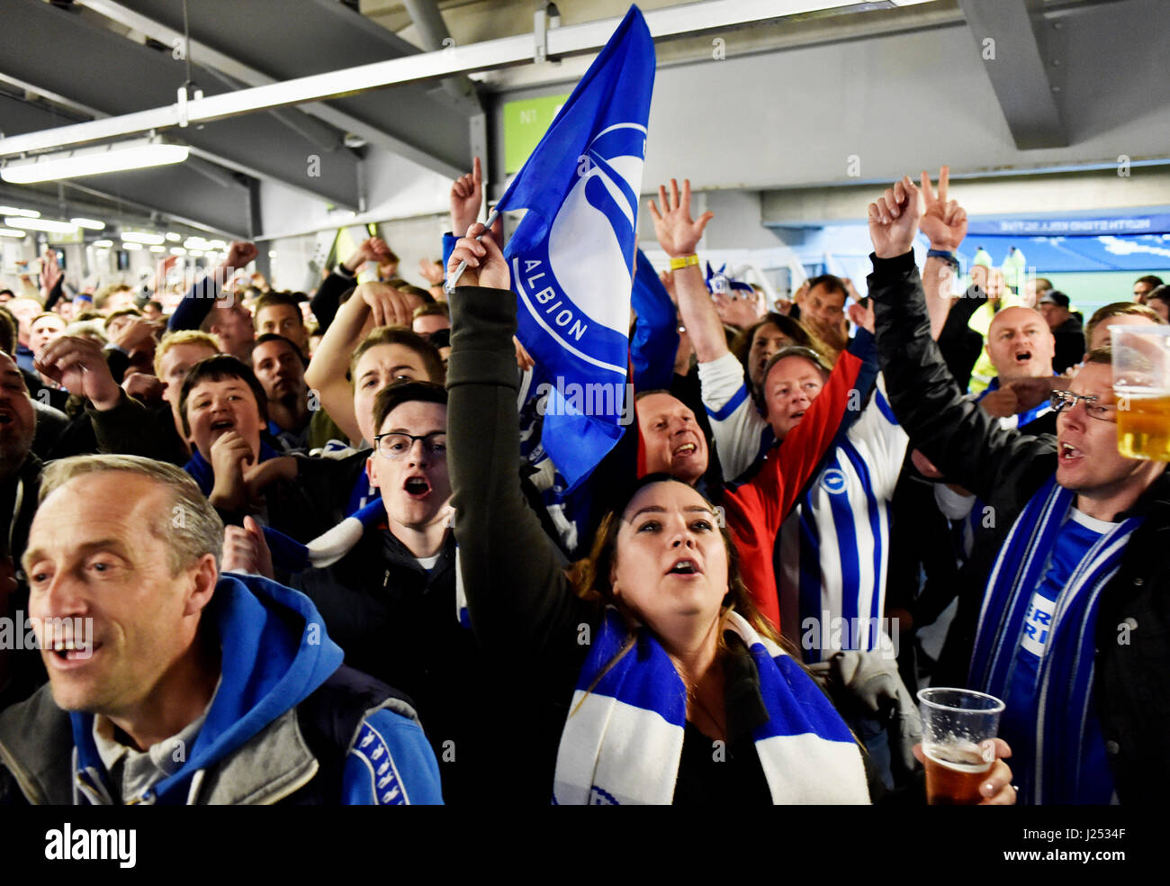 Brighton fans celebrate promotion in stadium bars as Hudderfield can ...