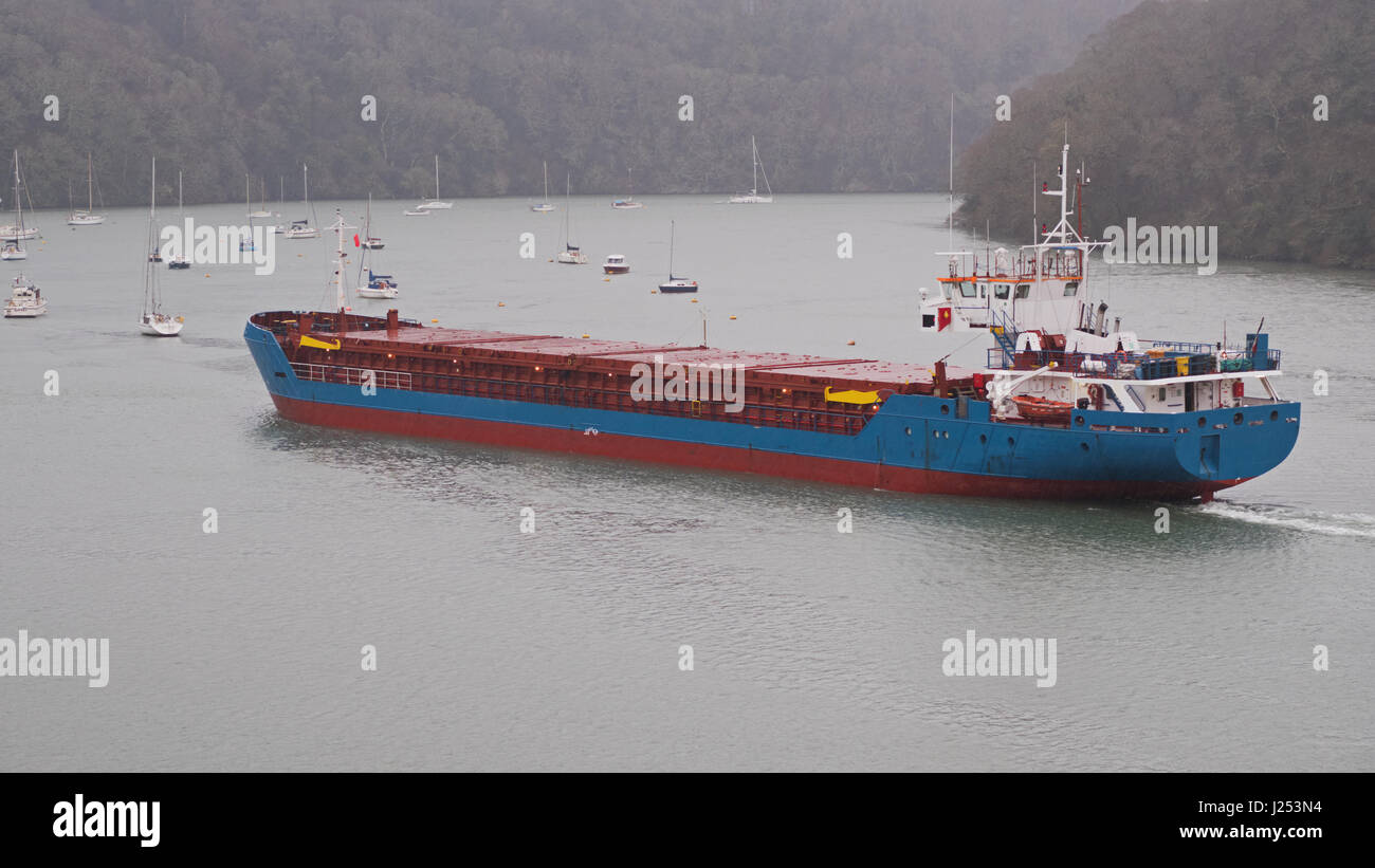 Cargo ship making its way in driving rain up the Truro river near ...