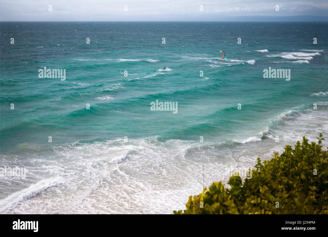 Kite surfer riding on waves hi-res stock photography and images - Alamy