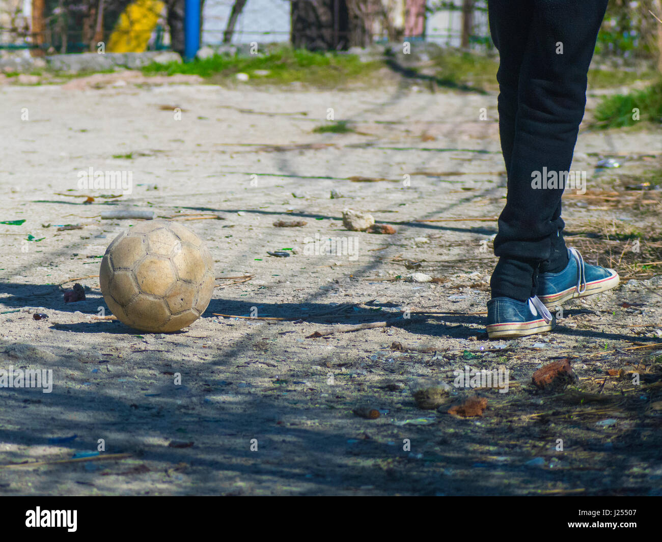 The soccer player's legs and soccer ball Stock Photo - Alamy