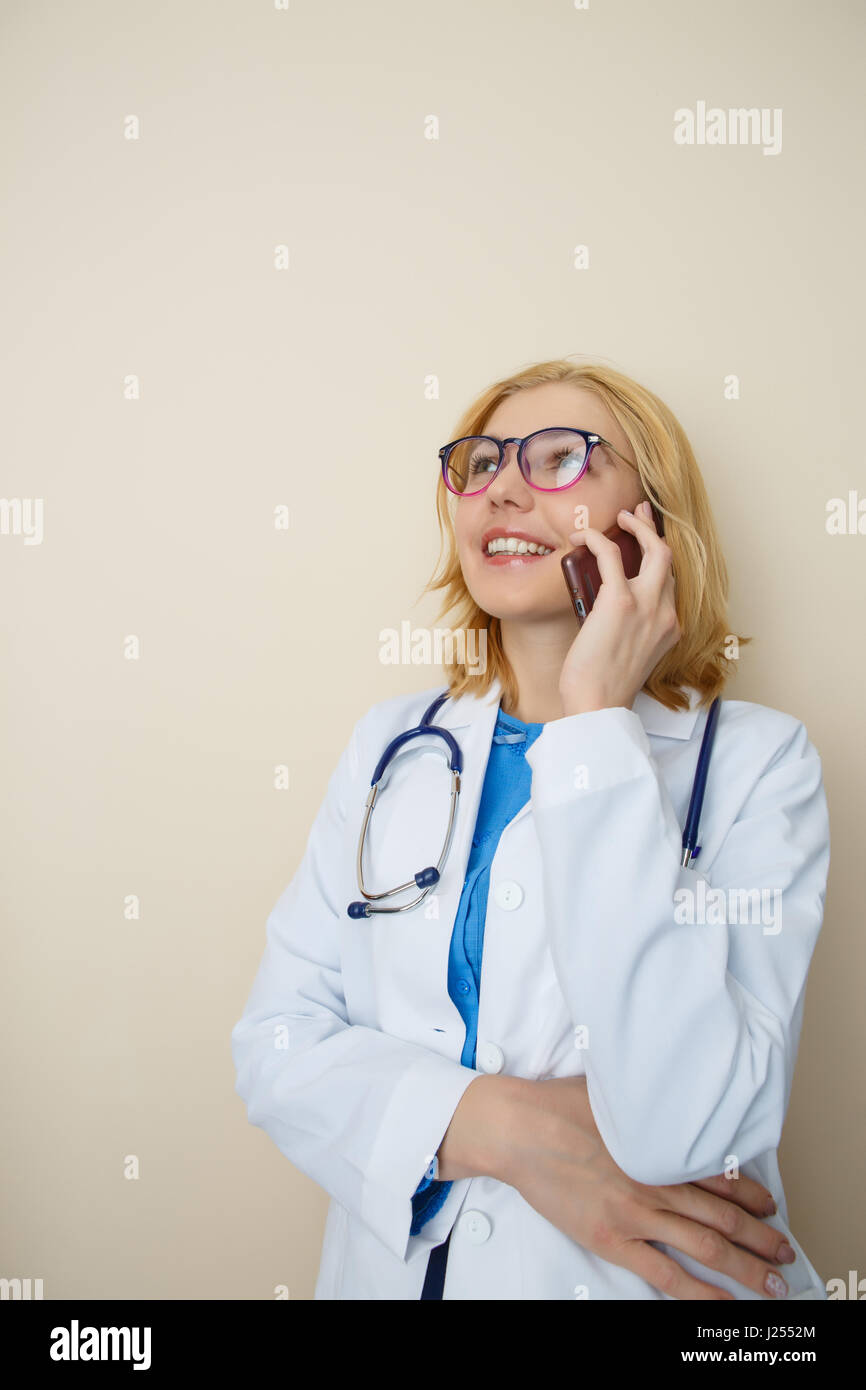 Young doctor talking on phone Stock Photo - Alamy