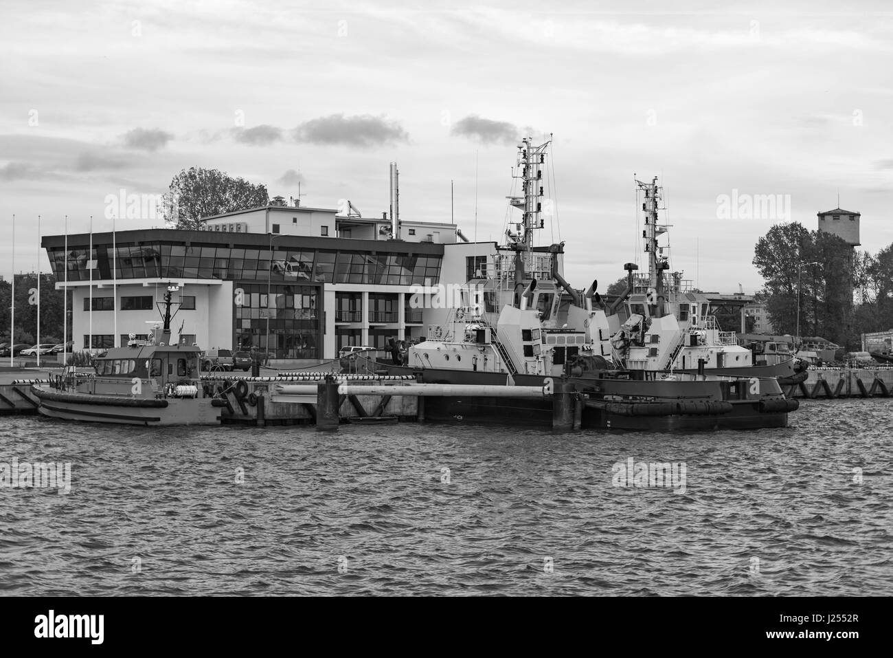 Ship row along the harbor shoreline Stock Photo - Alamy